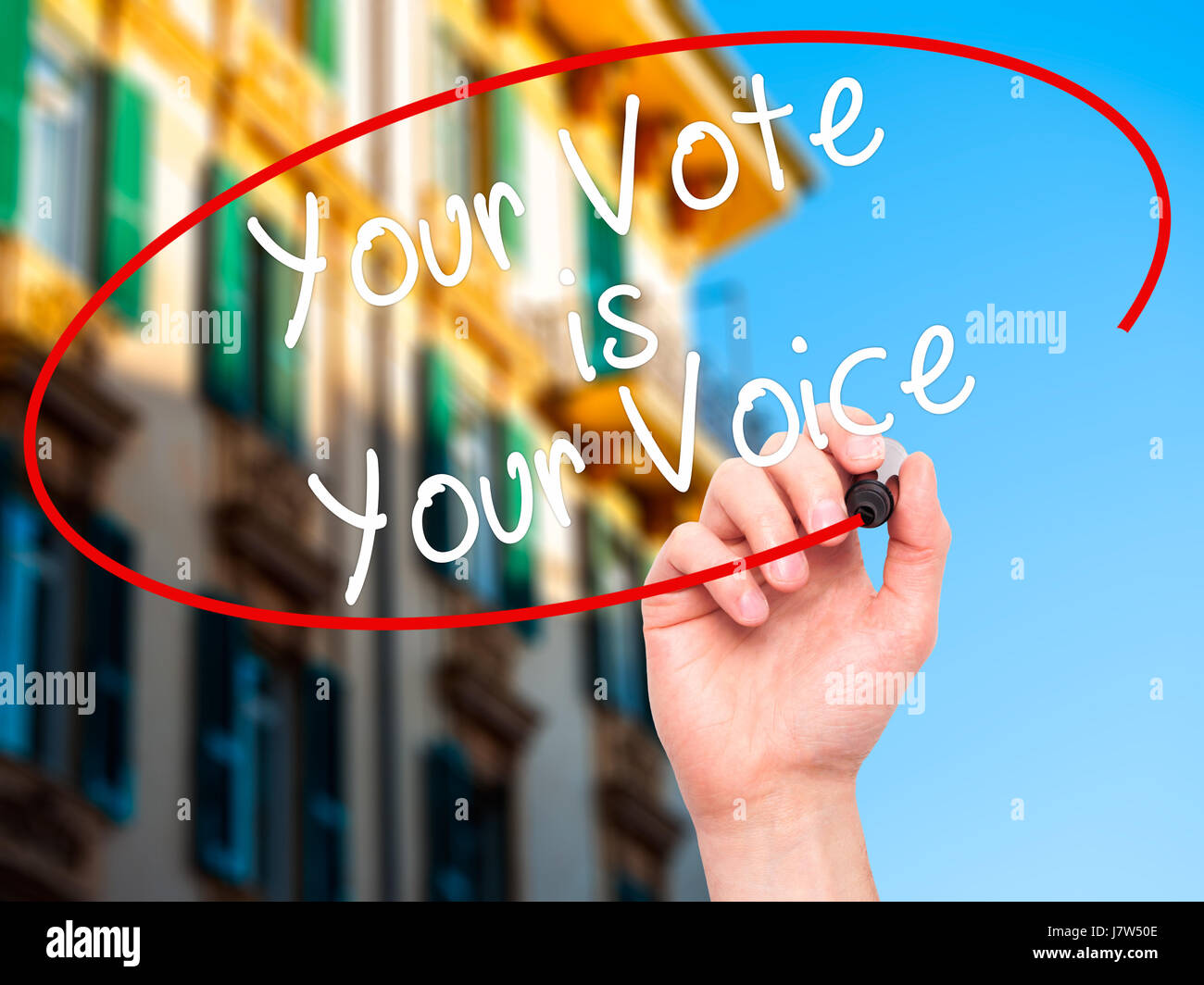 Man Hand writing Your Vote is Your Voice with black marker on visual ...