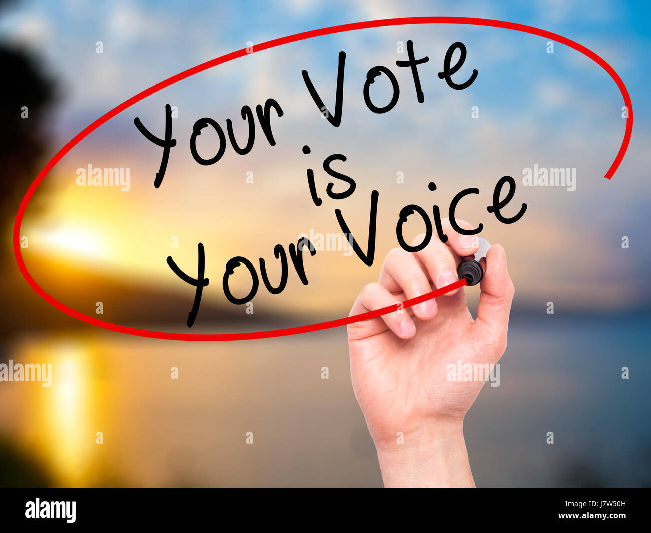Man Hand writing Your Vote is Your Voice with black marker on visual ...
