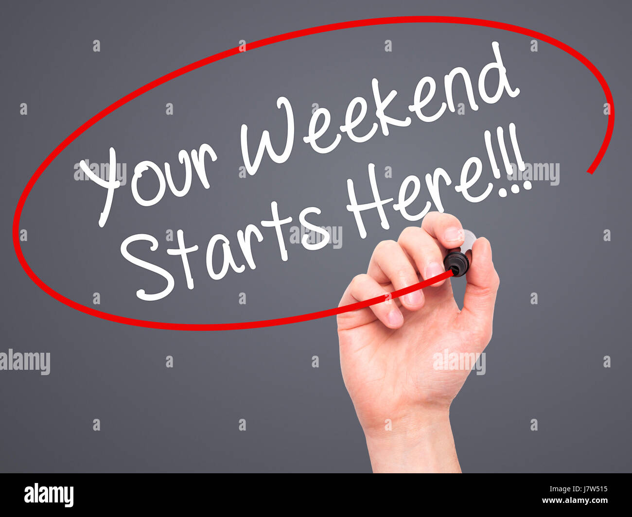 Man Hand writing Your Weekend Starts Here!!! with black marker on ...