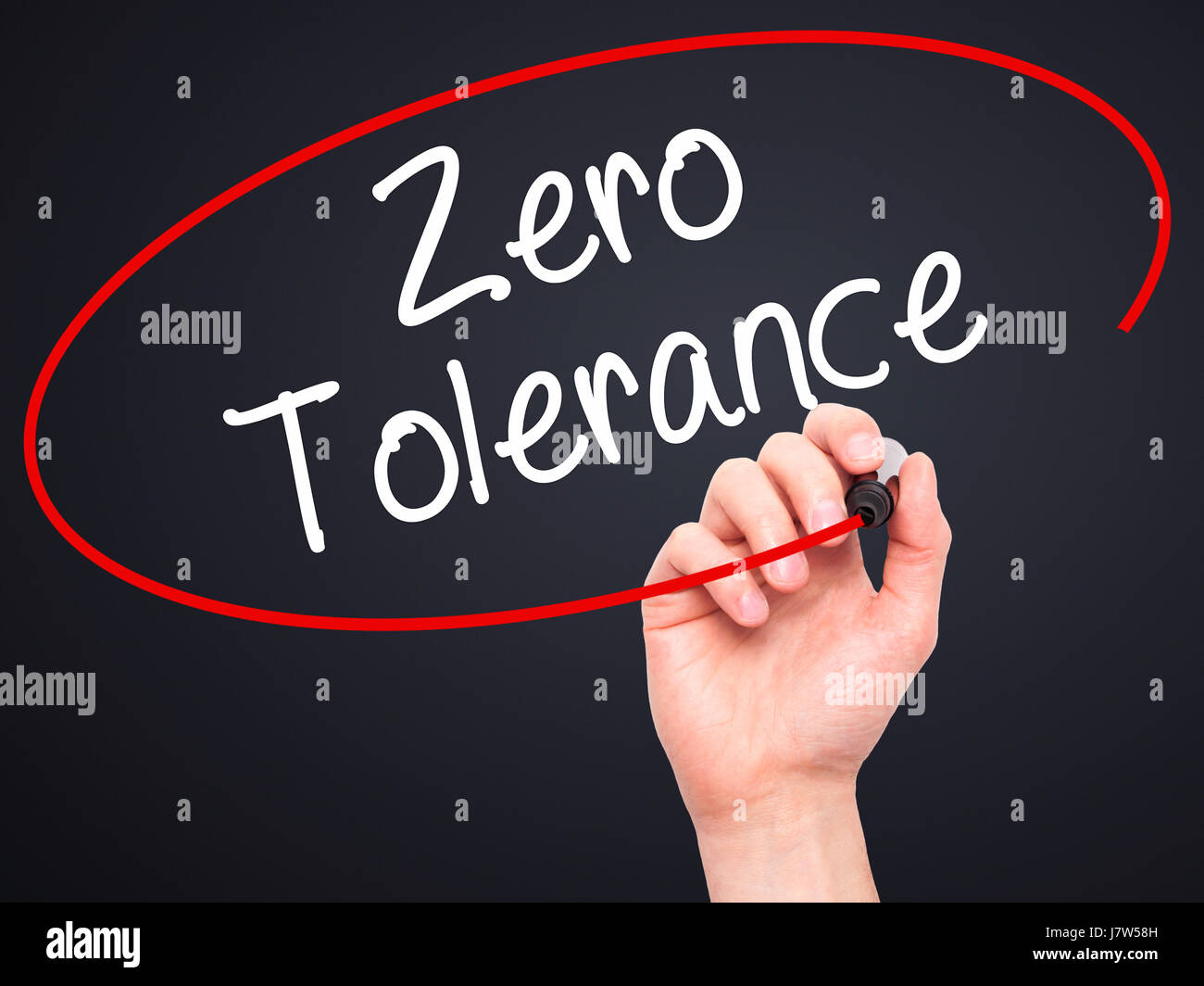 Man Hand writing Zero Tolerance with black marker on visual screen ...