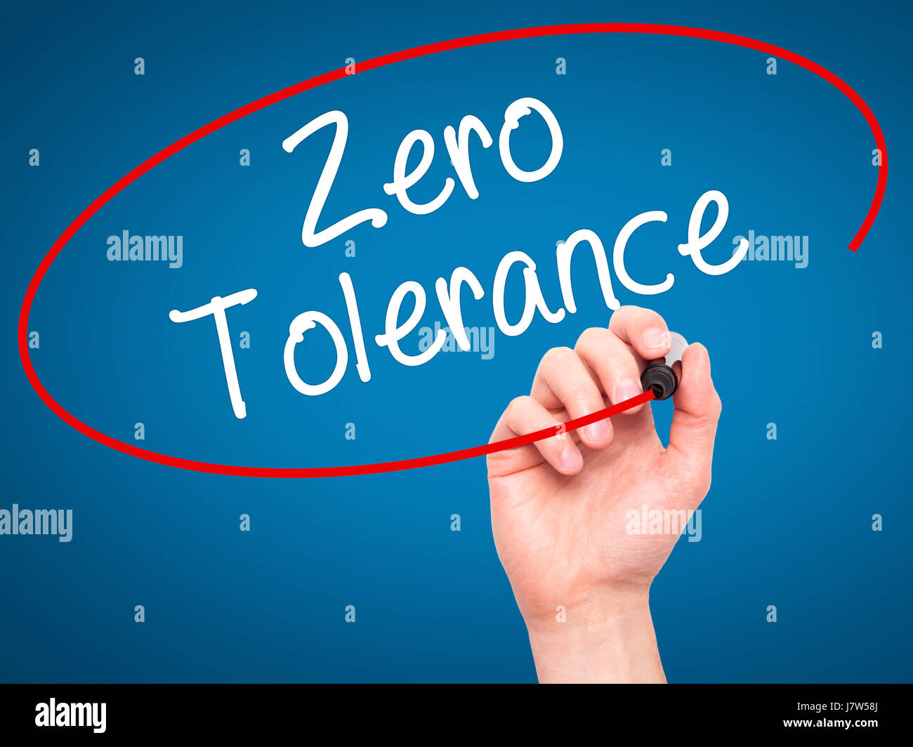 Man Hand writing Zero Tolerance with black marker on visual screen ...