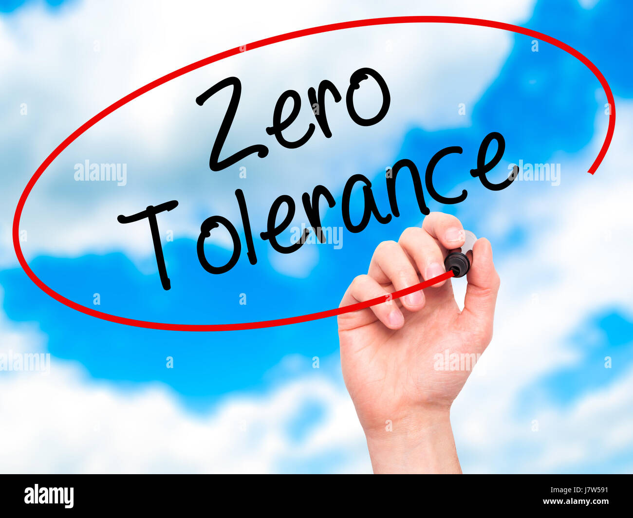 Man Hand writing Zero Tolerance with black marker on visual screen ...