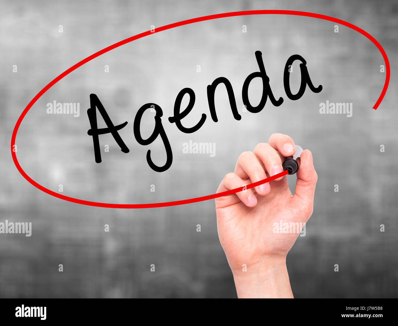 Man Hand writing Agenda with marker on transparent wipe board. Isolated ...