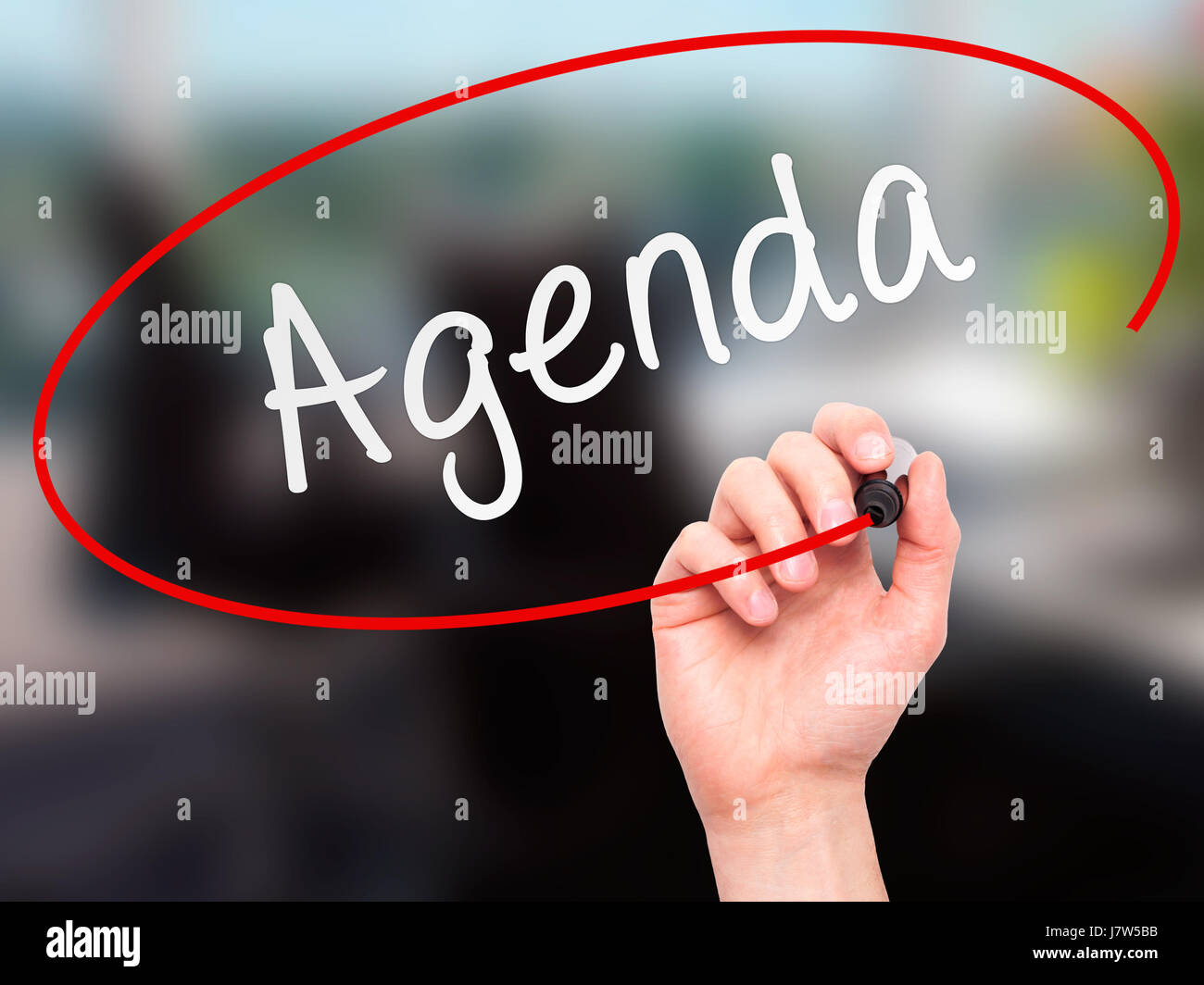 Man Hand writing Agenda with marker on transparent wipe board. Isolated ...