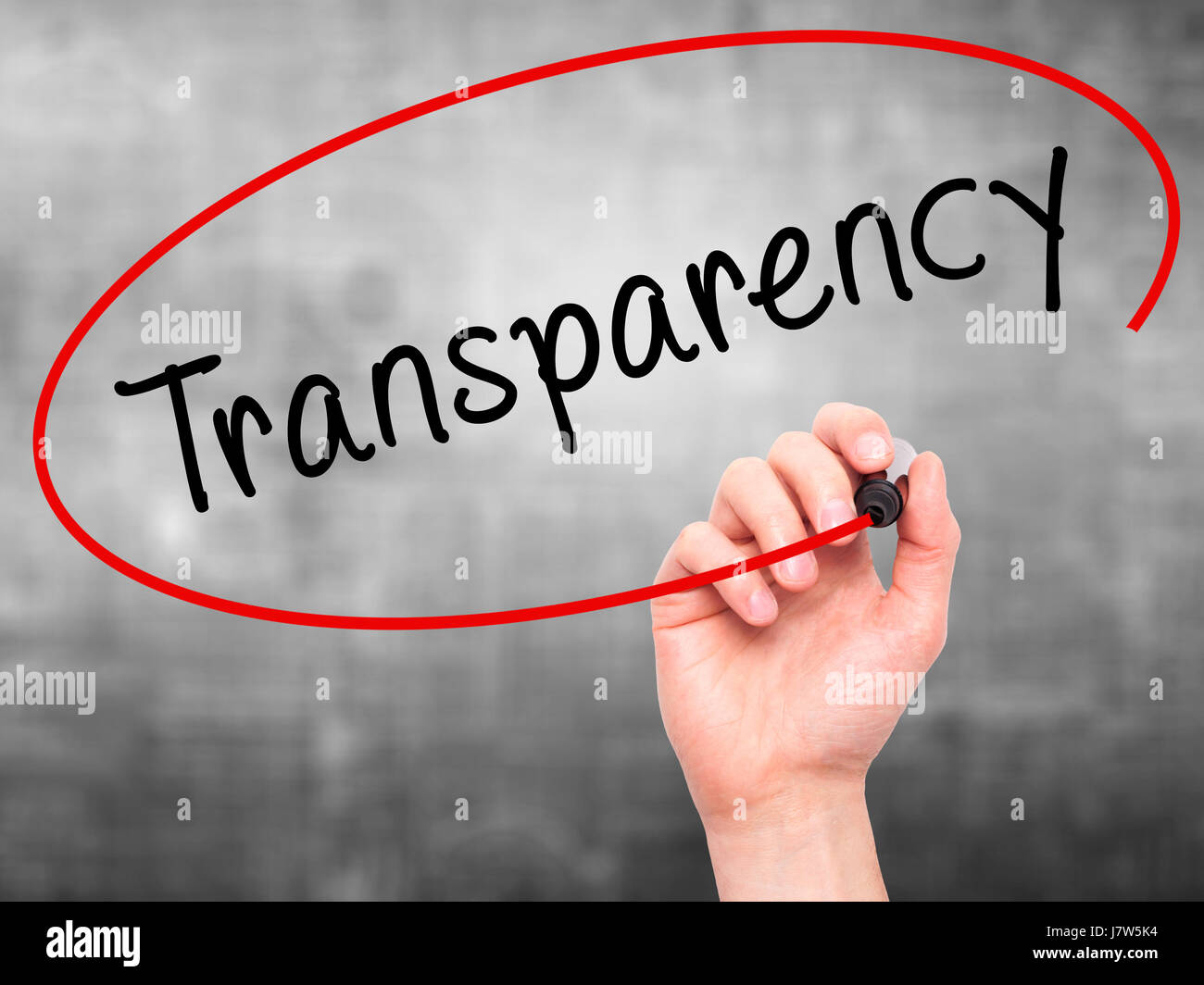 Man Hand writing Transparency with marker on transparent wipe board ...