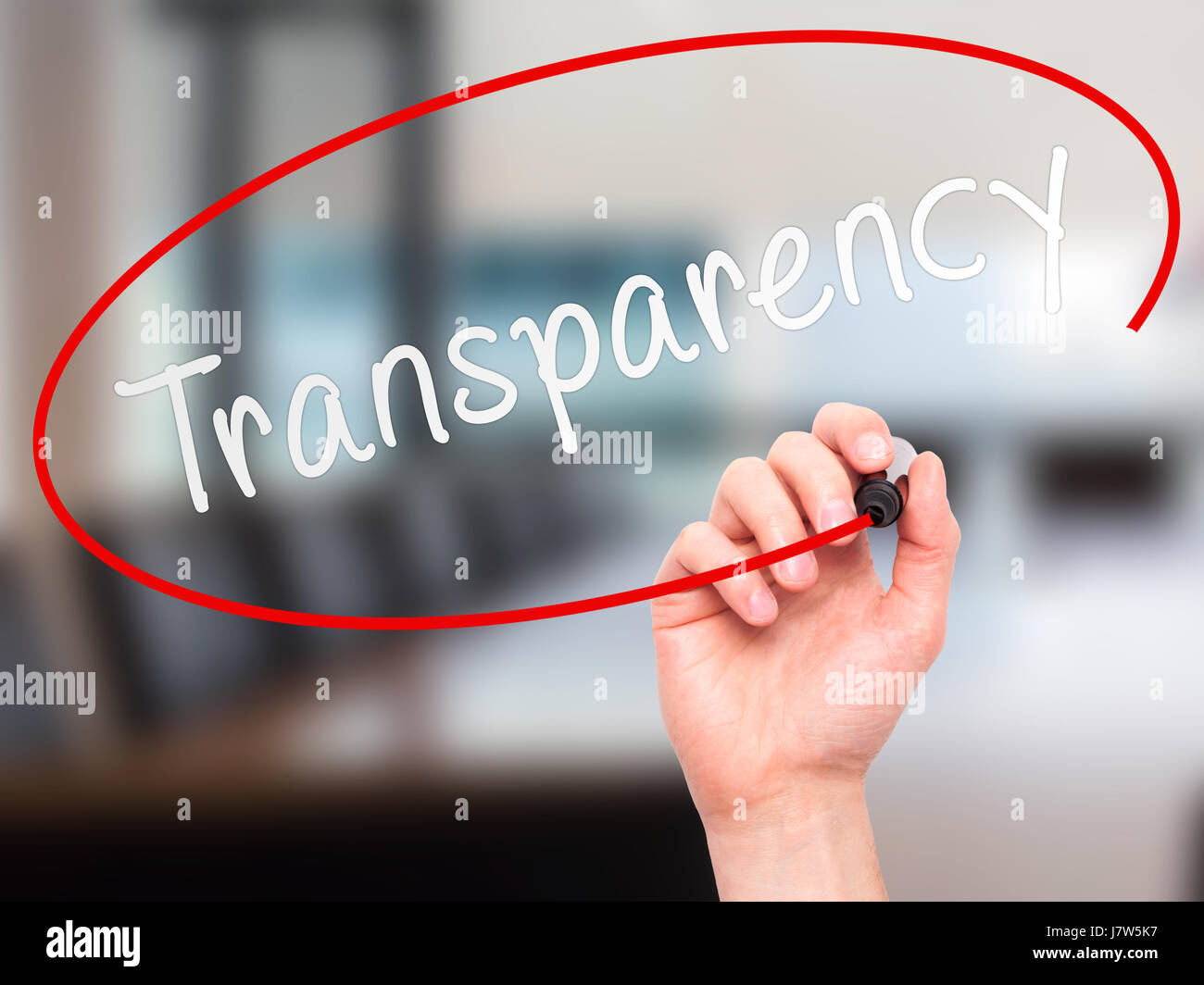 Man Hand writing Transparency with marker on transparent wipe board ...