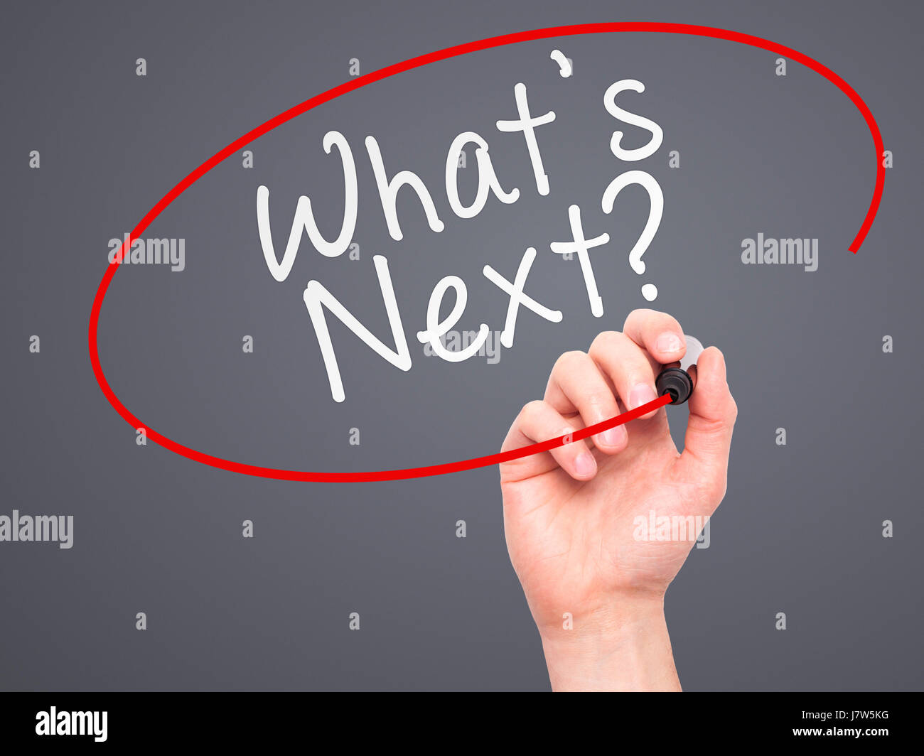 Man Hand writing What's Next? with marker on transparent wipe board ...