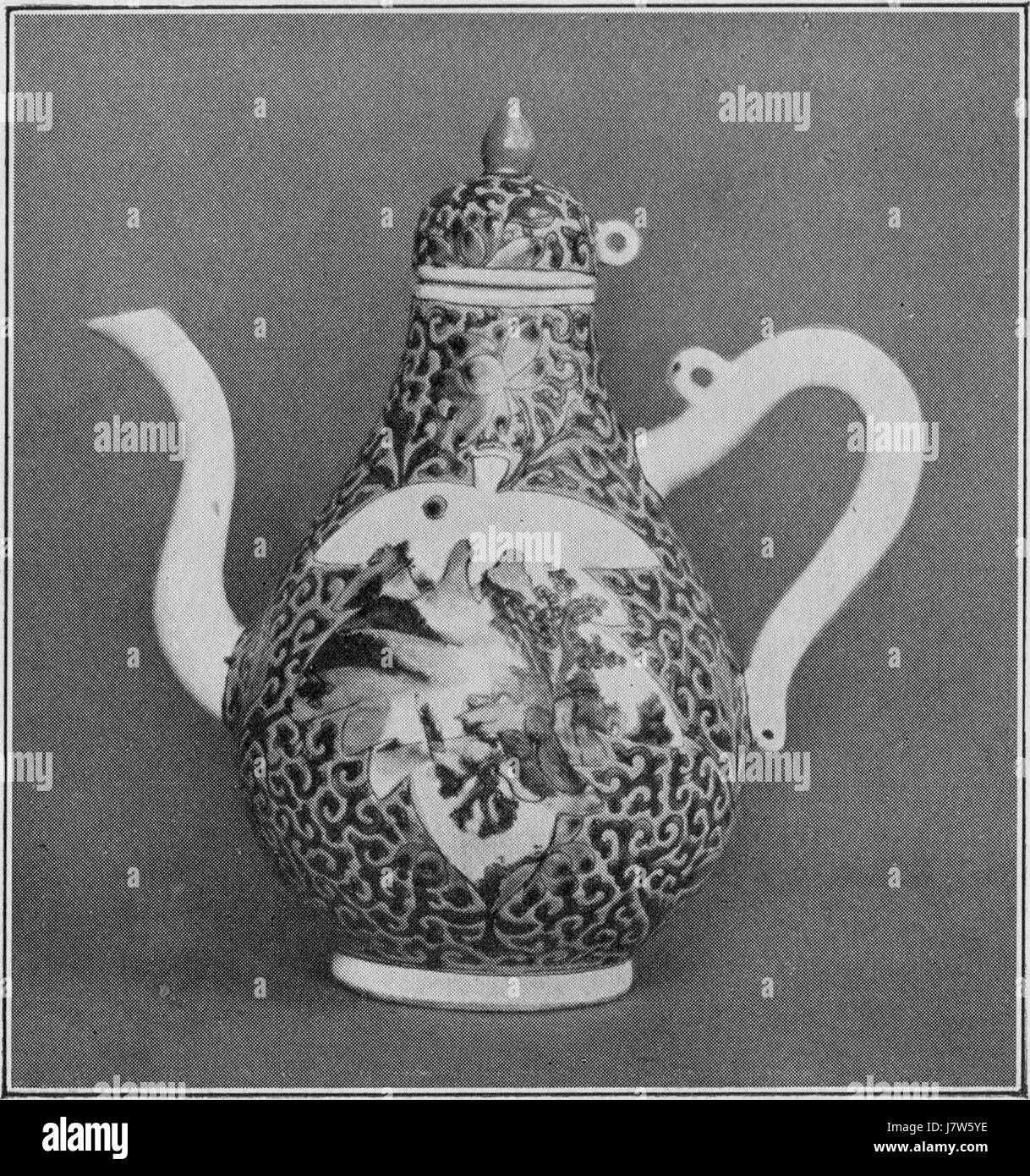 This image depicts a teapot, likely an antique or decorative piece ...
