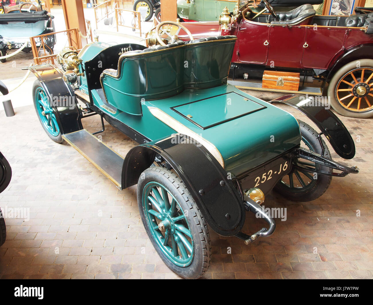 This 1910 photograph showcases the Peugeot Type 125 Runabout, an early ...