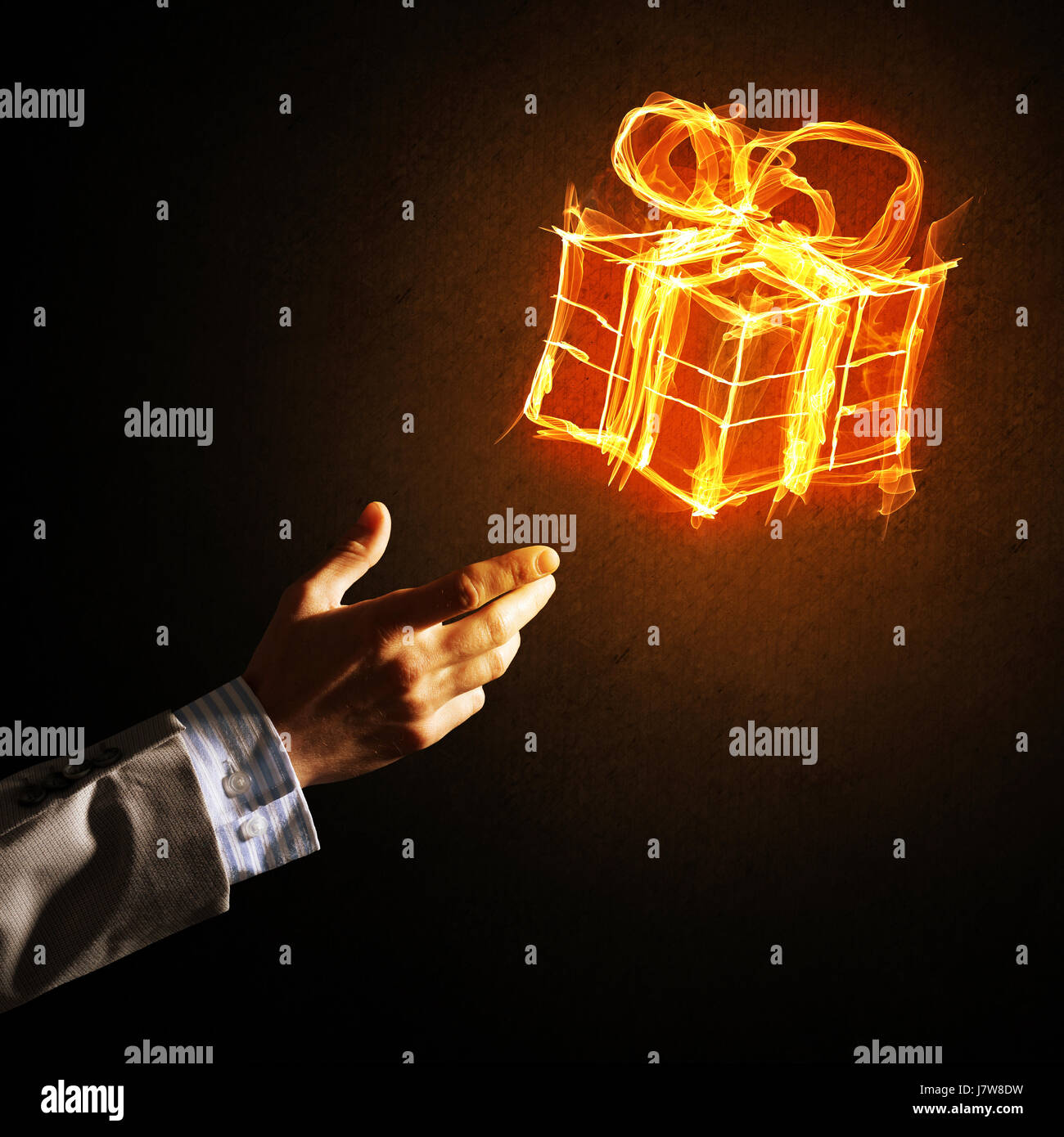 Concept of celebration with fire burning gift symbol and businessman ...