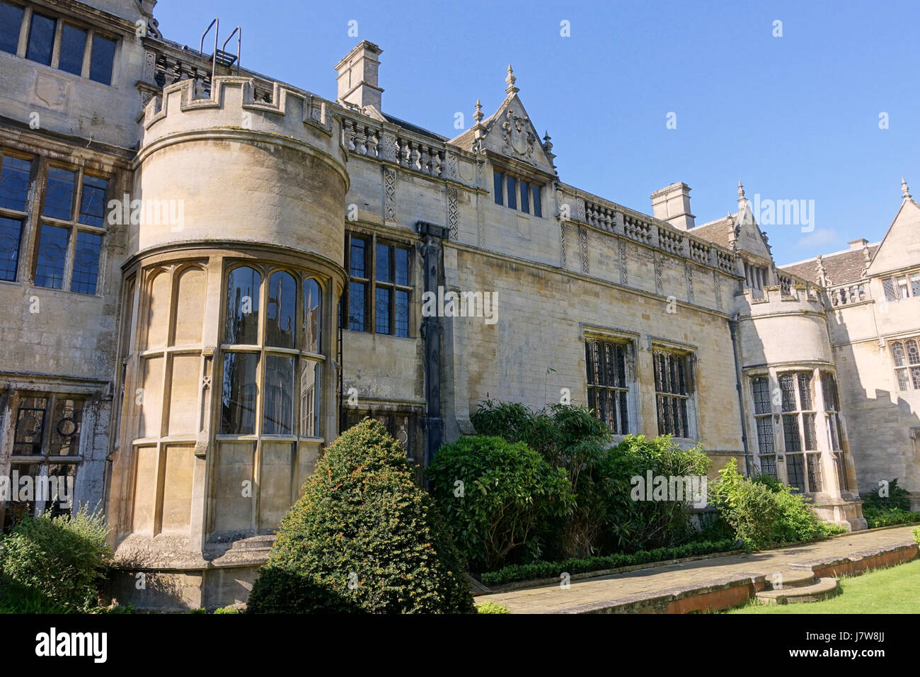 This image likely depicts the courtyard of Rushton Hall, a historic ...