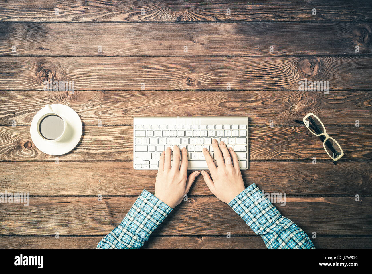 Top view of woman sitting at table with hands folded Stock Photo - Alamy