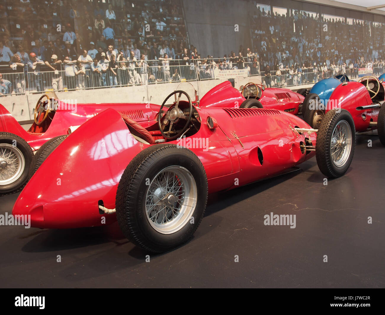 This photograph features the 1939 Maserati GP 4CL, a racing car powered ...