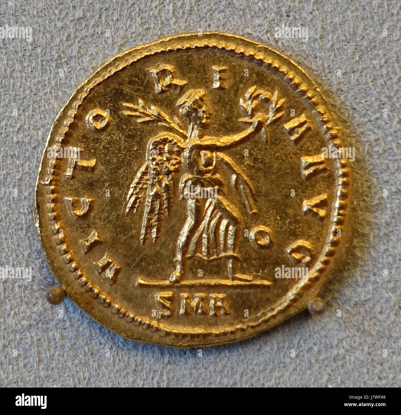 This aureus coin from the reign of Roman Emperor Diocletian, minted in ...