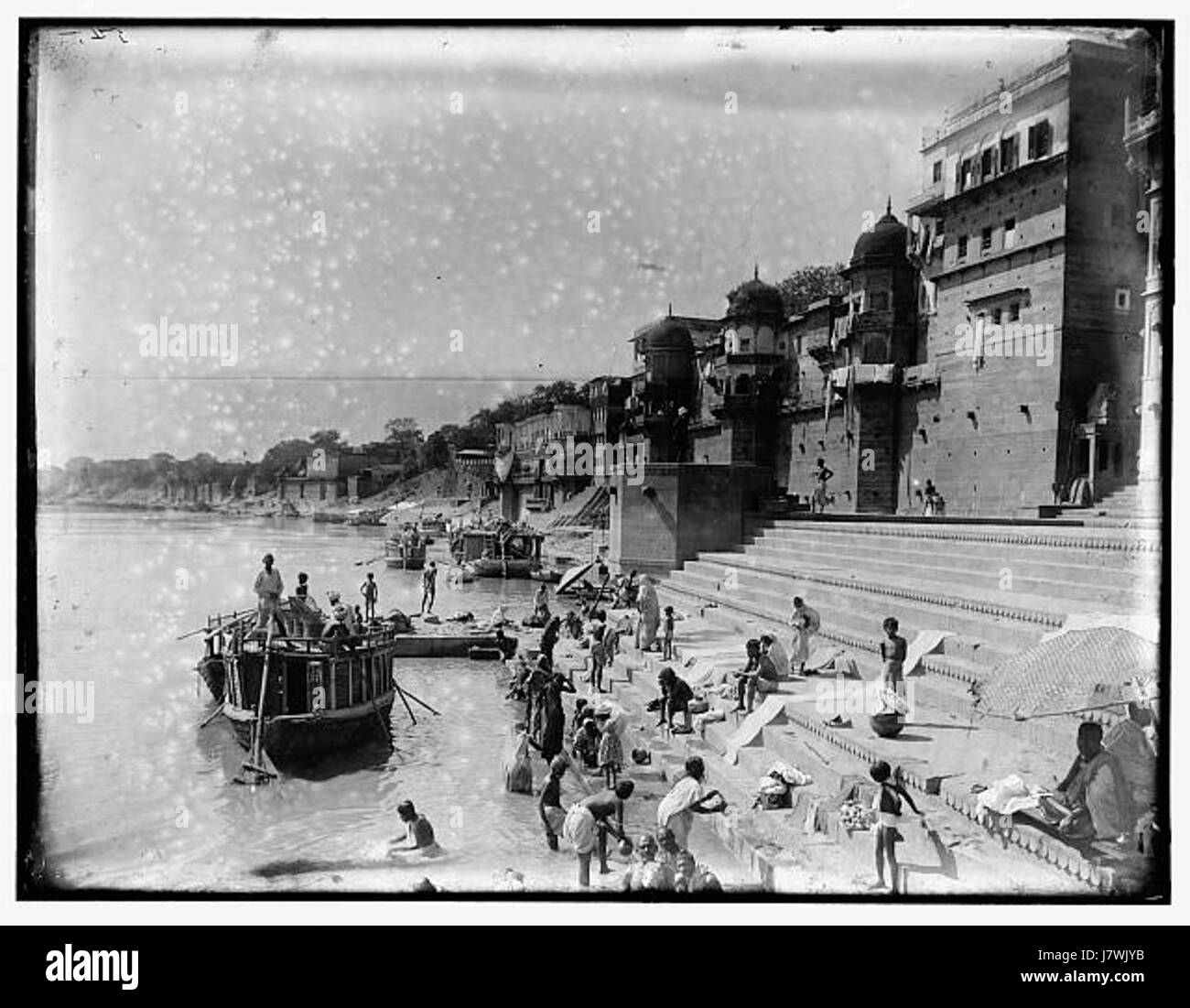 Photograph capturing the ritual of bathing in the Ganges River in 1895 ...