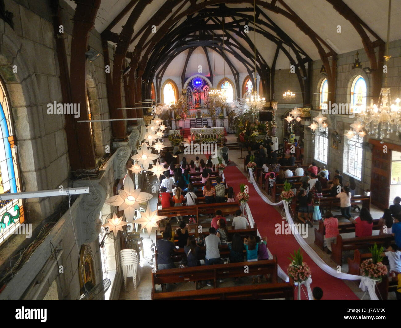 This image captures a wedding ceremony at the Saint Ildephonsus of ...