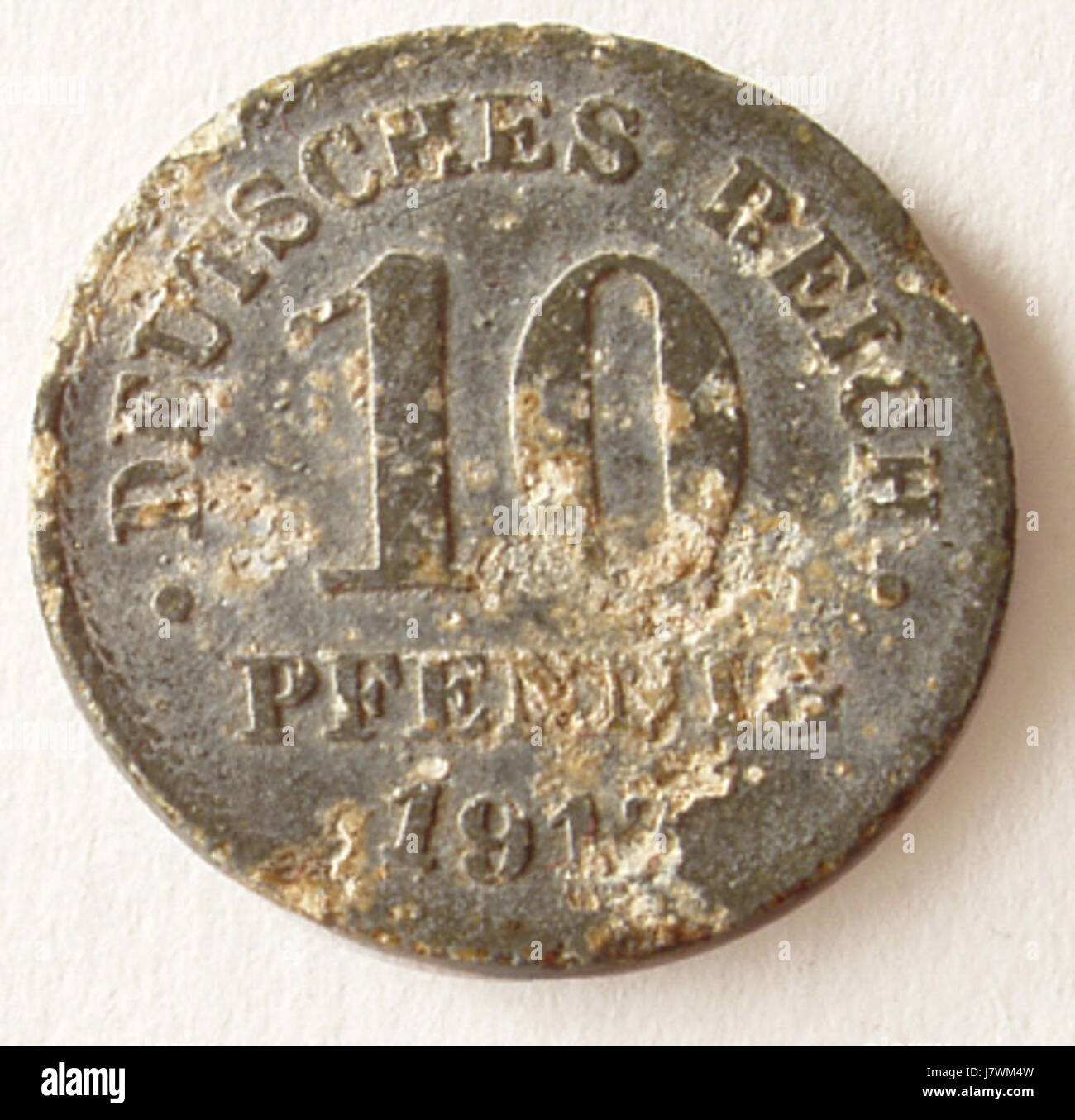 This coin, a 10 Pfennig issued in 1917, shows the reverse side affected ...