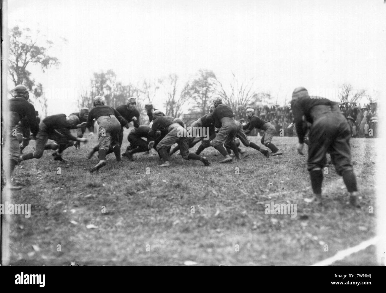 This historic photograph captures a football game between Miami and ...