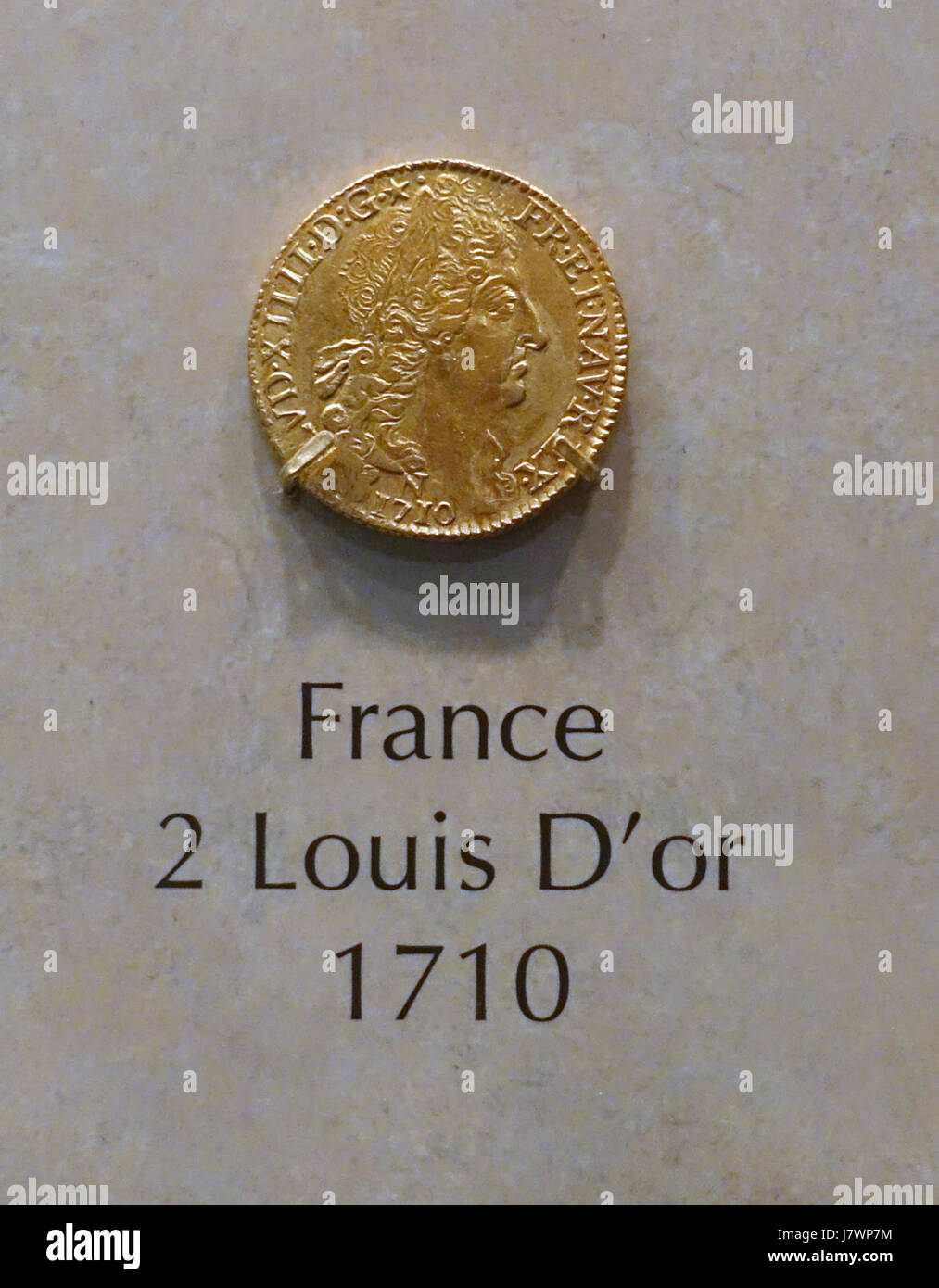 This coin, a 1710 Louis d'or from France, is a historical example of ...