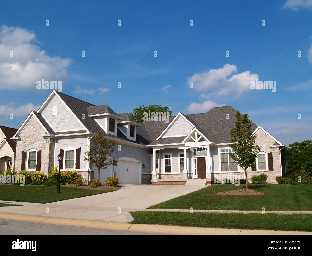 house building stone outside garage real estate driveway exterior home ...