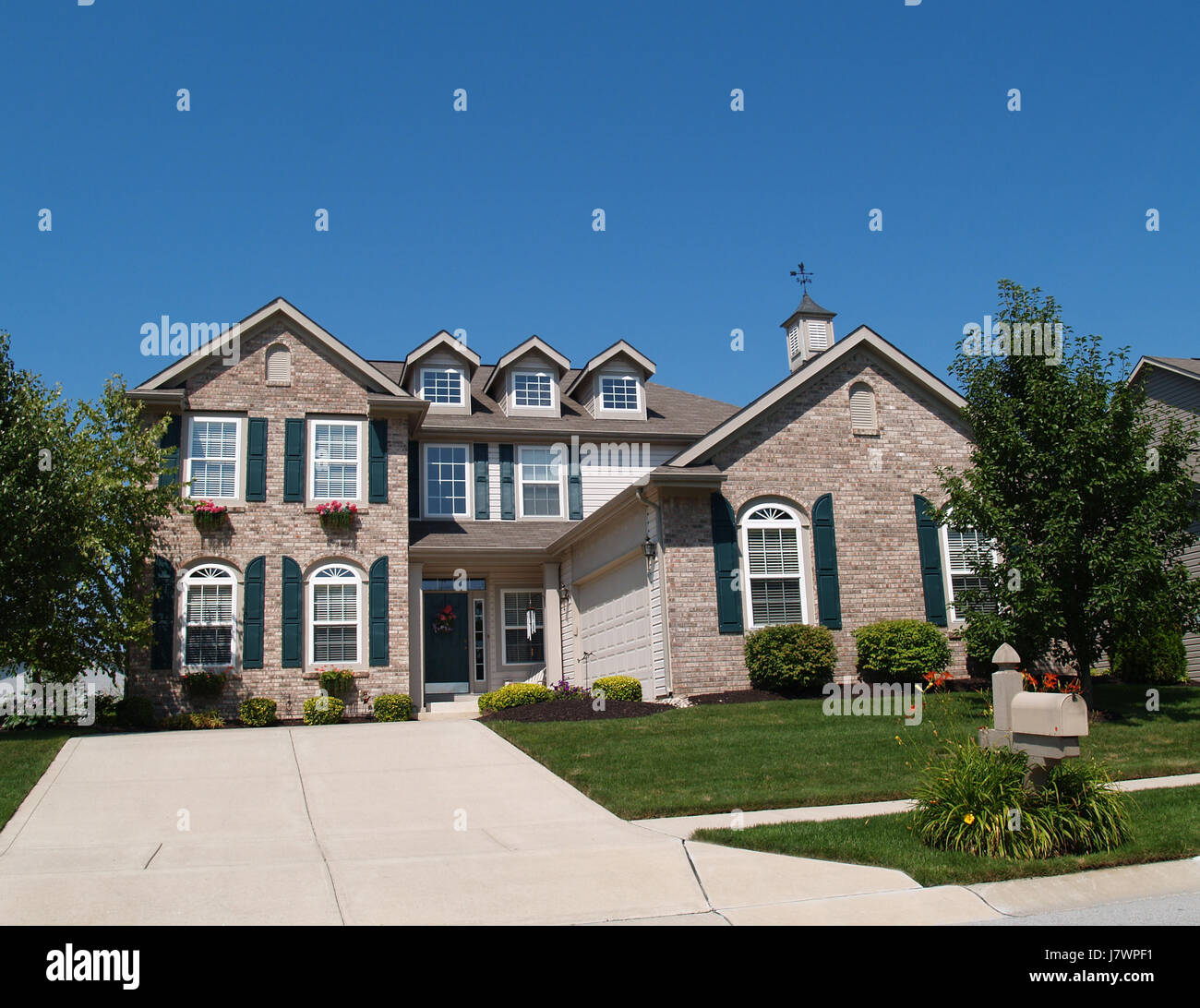 house building outside garage brick real estate dormer exterior home ...