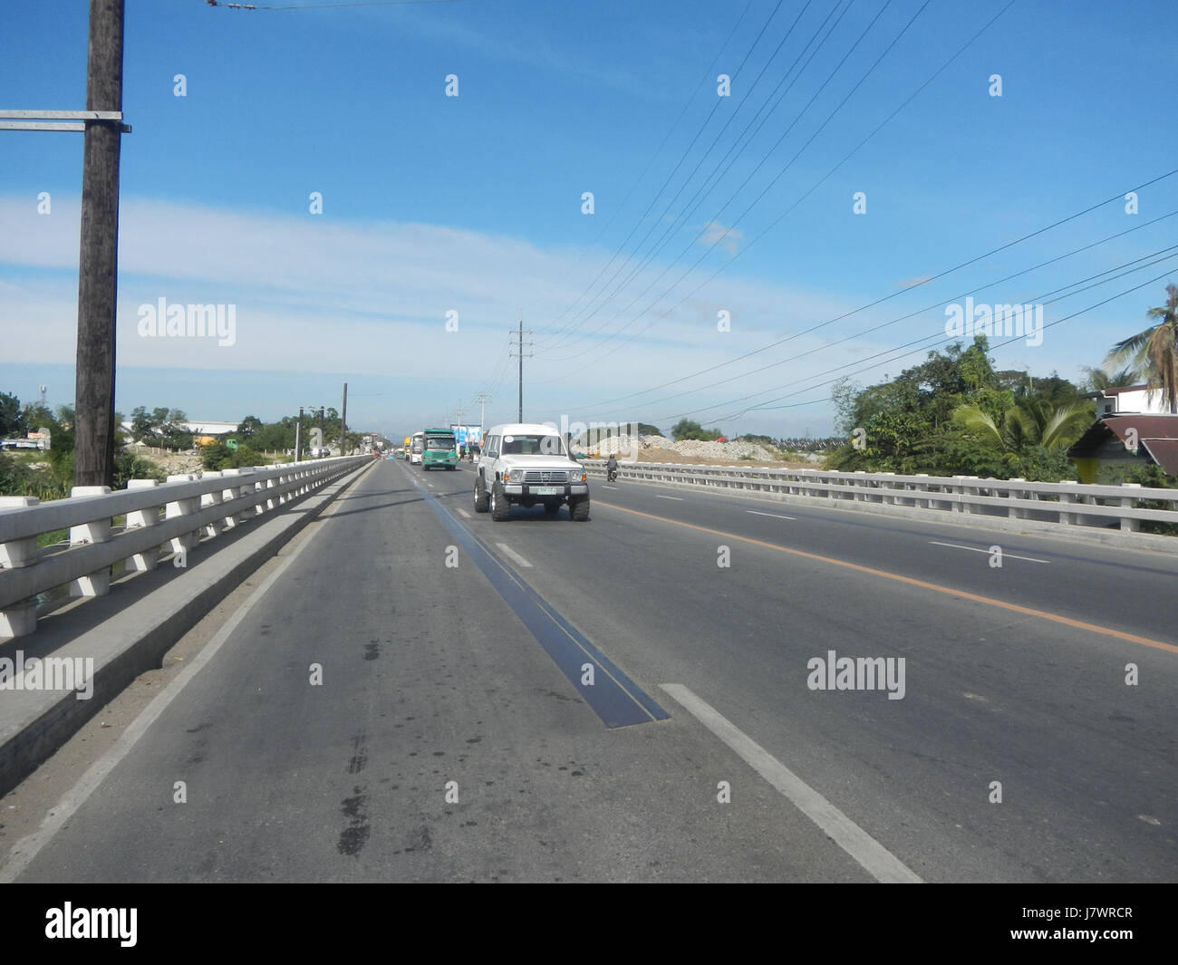 This image depicts the Santa Maria Bridge, located in Bulacan ...