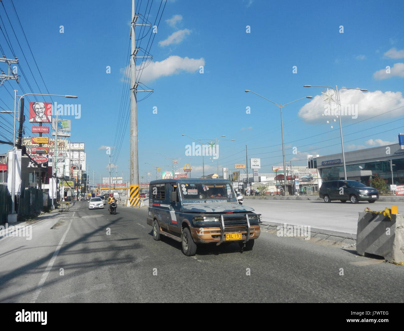 This image depicts Olongapo Gapan Road, which connects the cities of ...