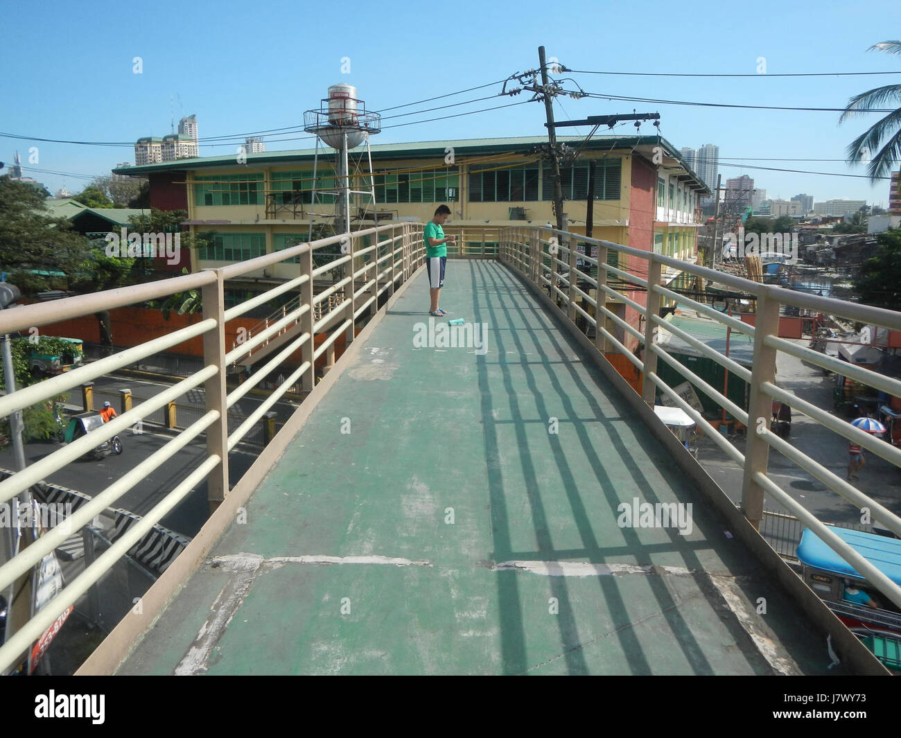 The pedestrian footbridge in Tayuman, Manila, connects various local ...