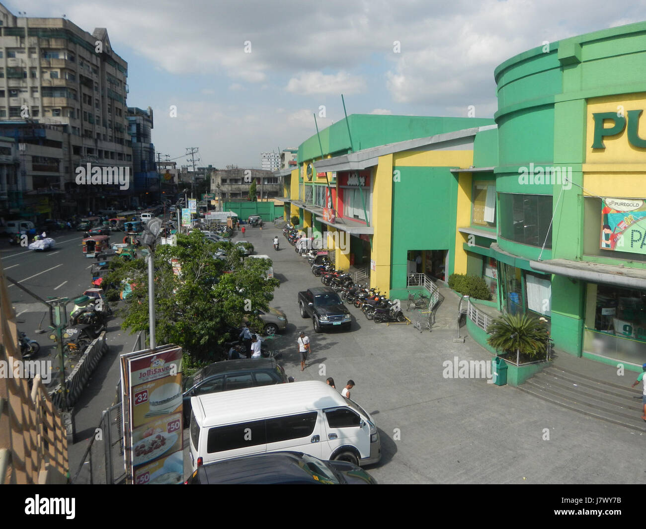 A reference to a pedestrian footbridge located near the Puregold ...