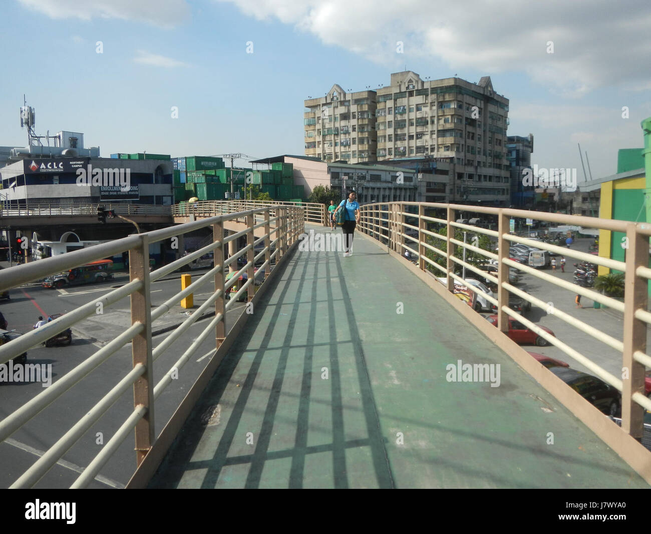 This image depicts a pedestrian footbridge in Tondo, Manila, located ...
