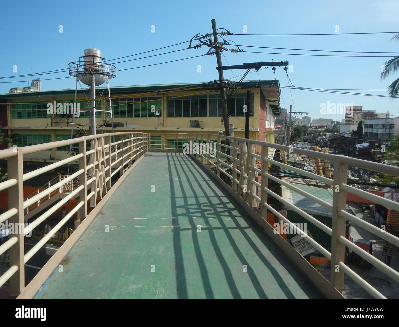 This image shows the pedestrian footbridge near Puregold in Tayuman ...