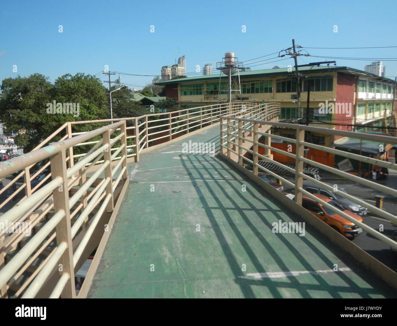This image features the pedestrian footbridge in the Tondo area of ...