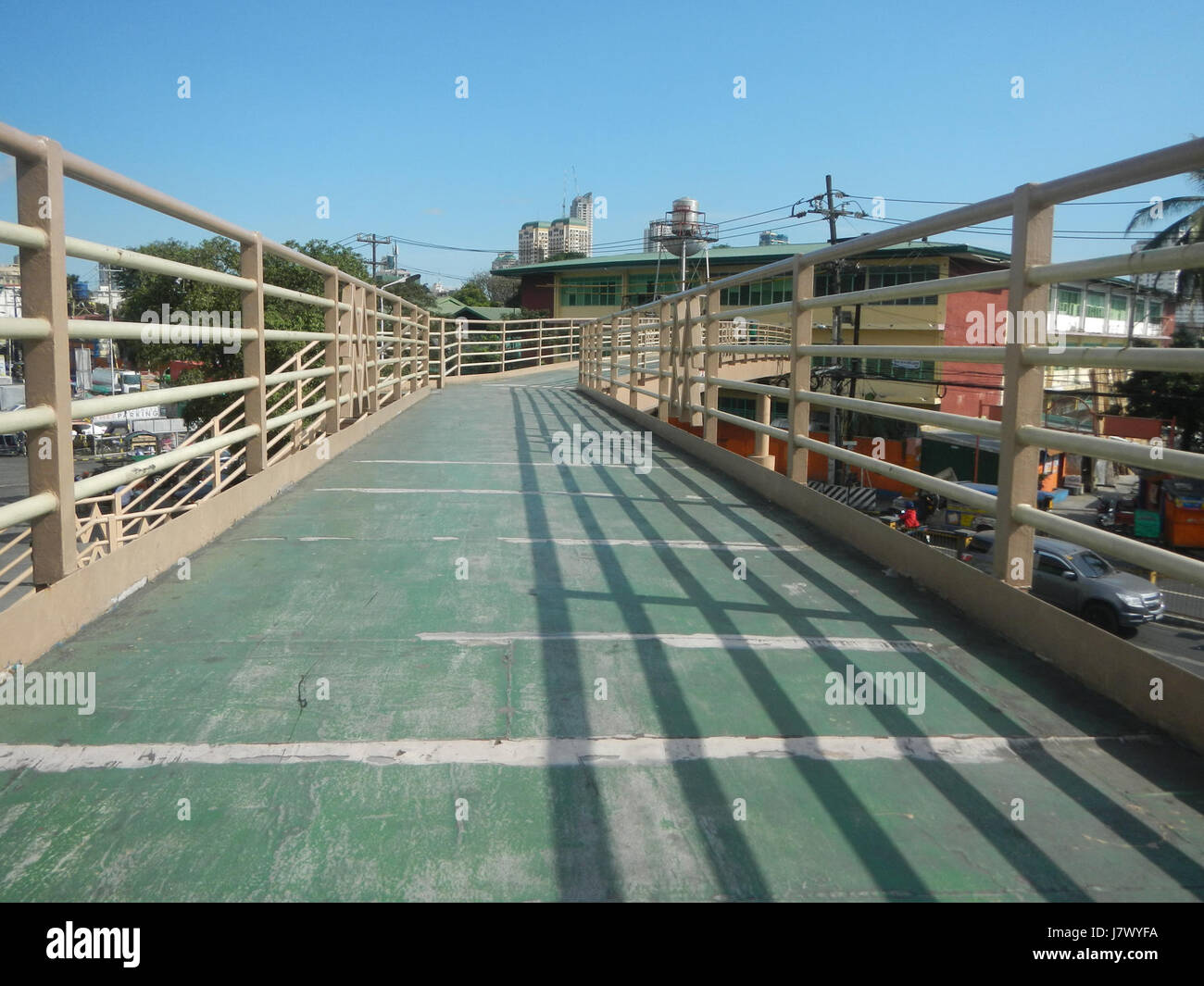 This image captures the pedestrian footbridge in the Tondo area of ...