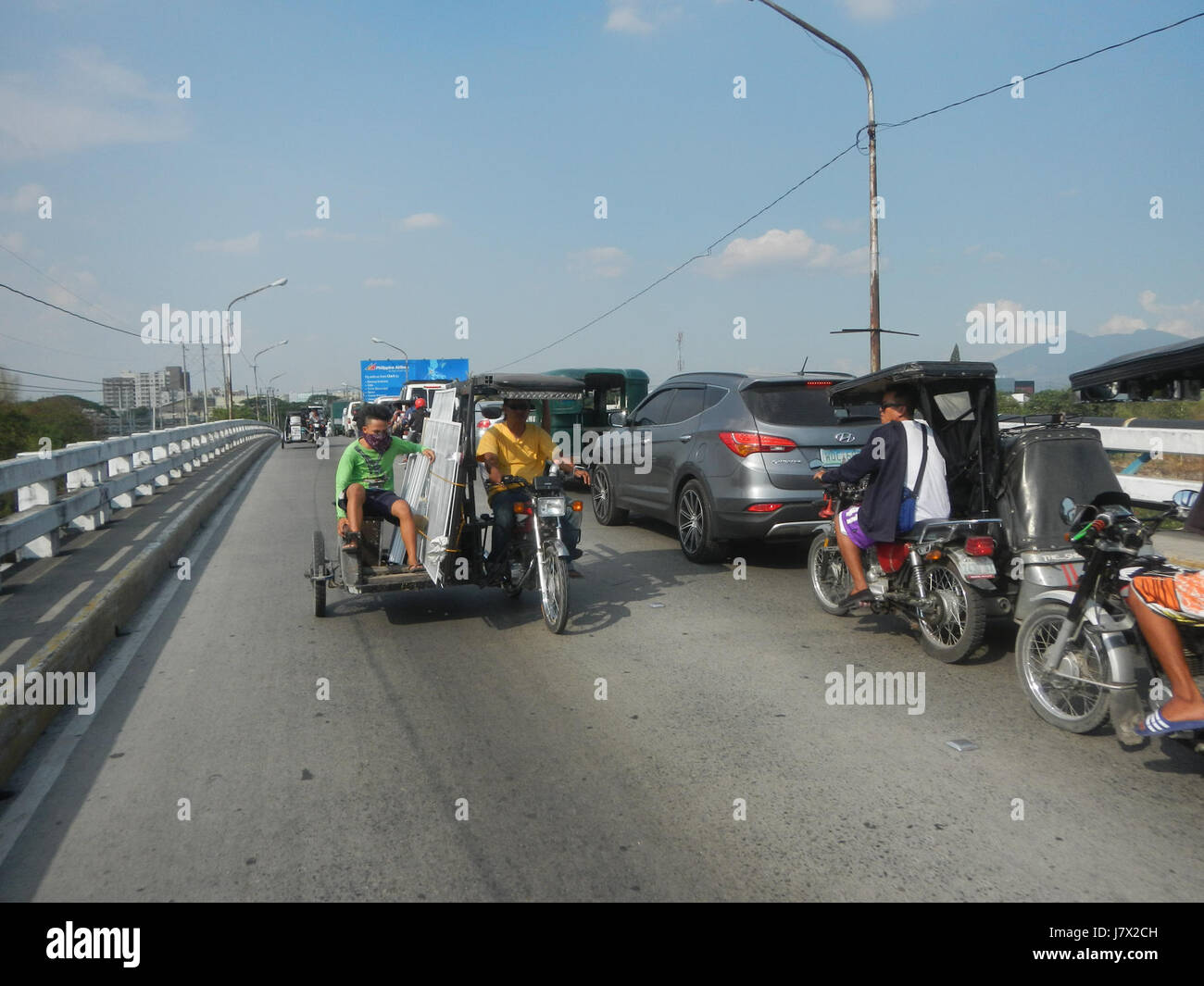 The image shows the Marquee Mall pedestrian footbridge in Angeles City ...