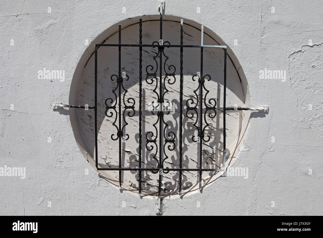 Round window with wrought iron grill in Highland Park, Los Angeles, CA ...