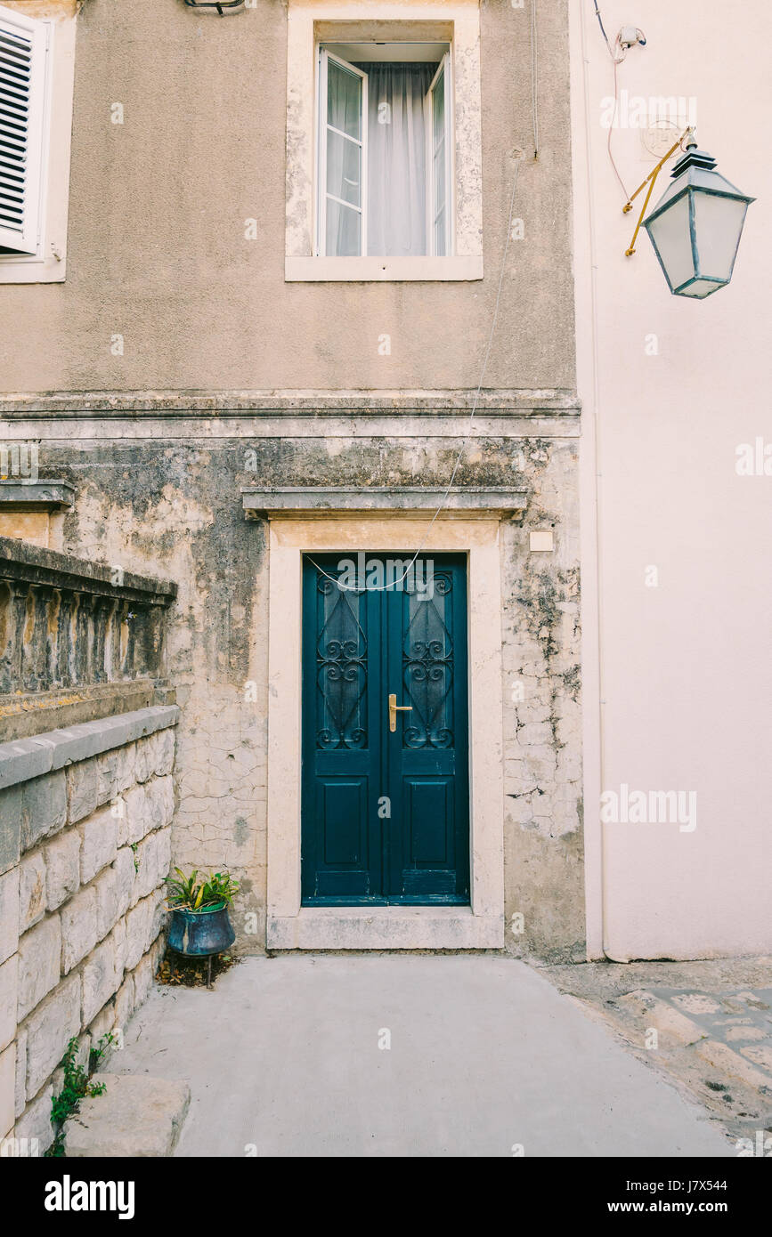 Old blue doors. Wood texture. Texture of metal. Old shabby, irradiated ...