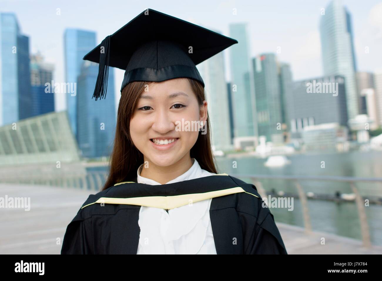 female chinese asian urban graduate woman laugh laughs laughing twit ...