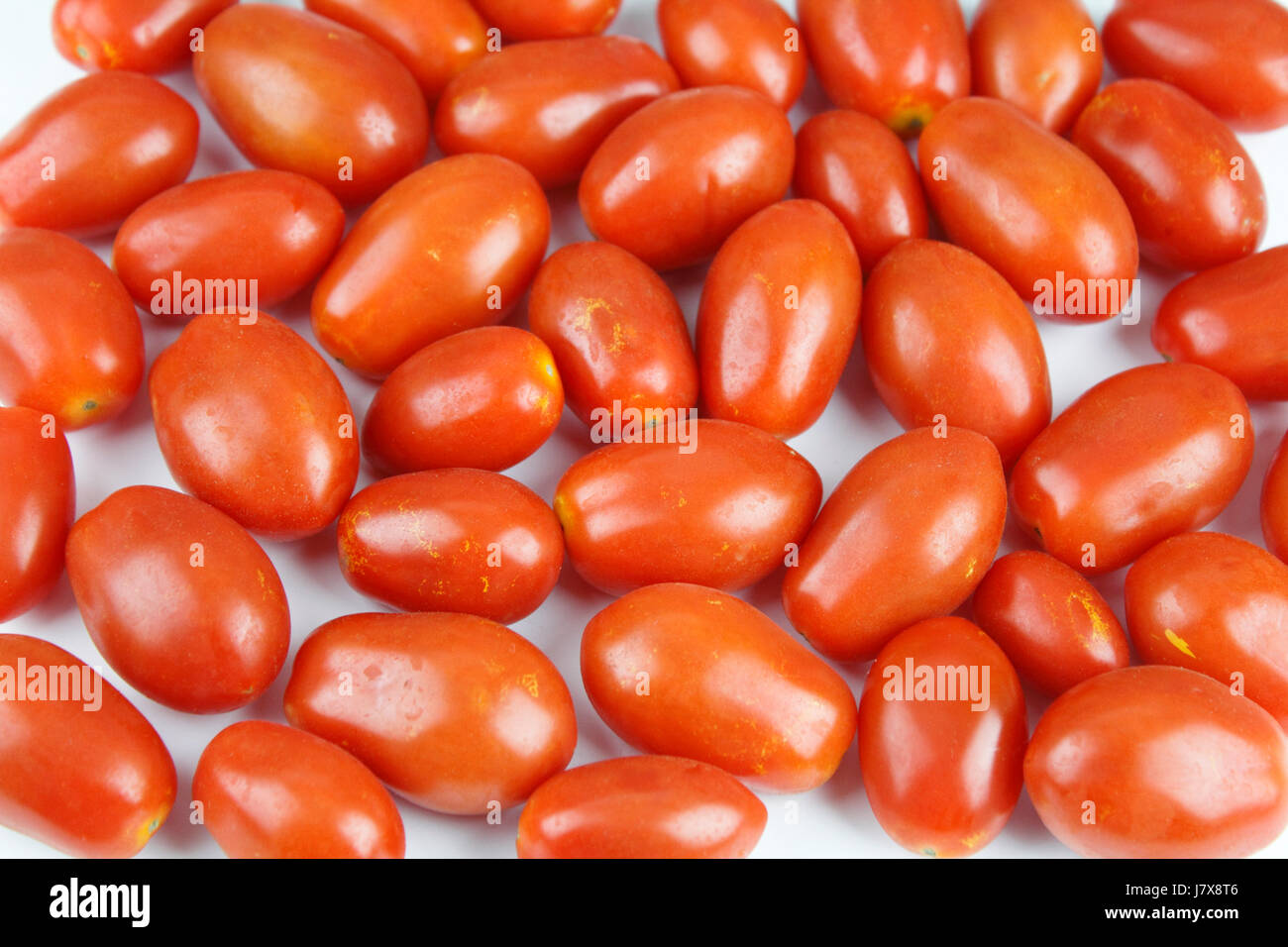 closeup small tiny little short tomatoes tomatos organic red food ...