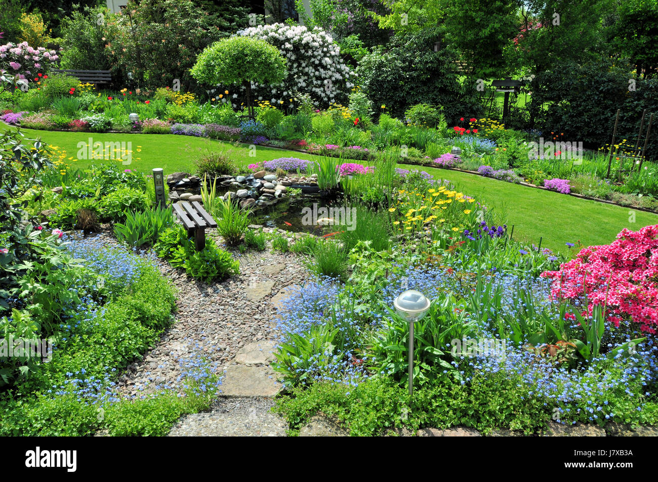 garden with pond and bench Stock Photo - Alamy