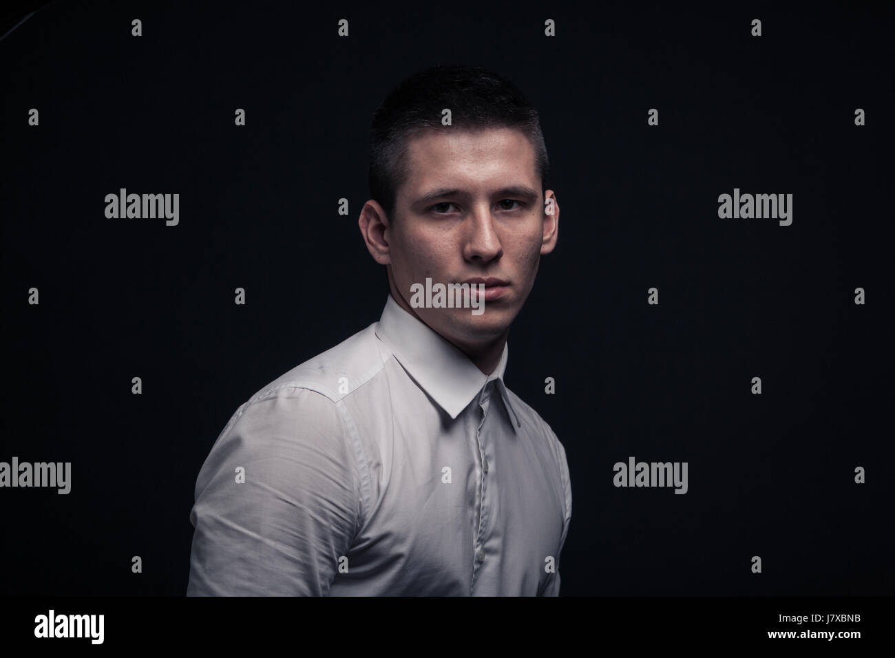 one young adult man only, head face headshot, sideways ,black ...