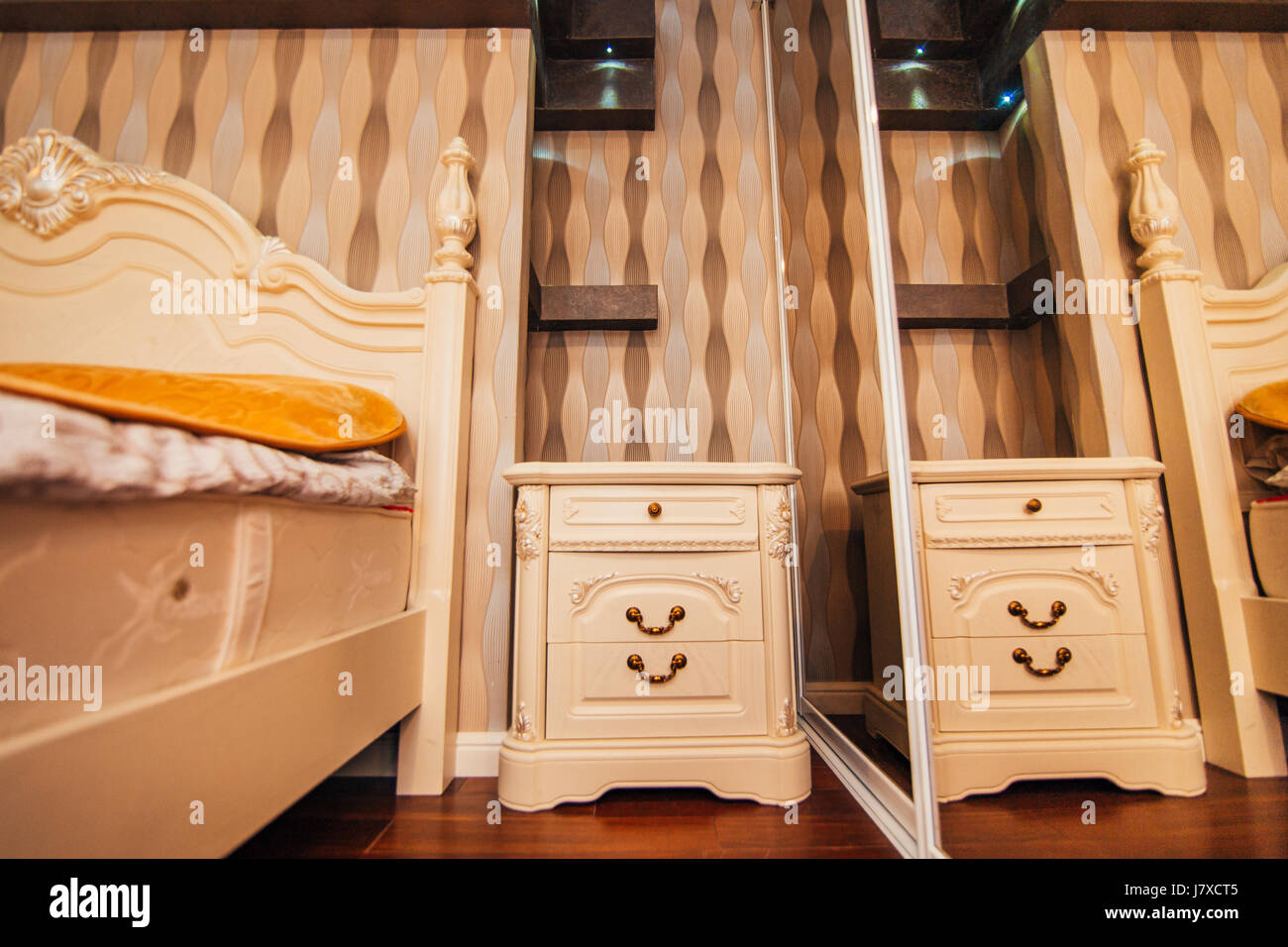 Bedside table in the bedroom next to bed Stock Photo - Alamy
