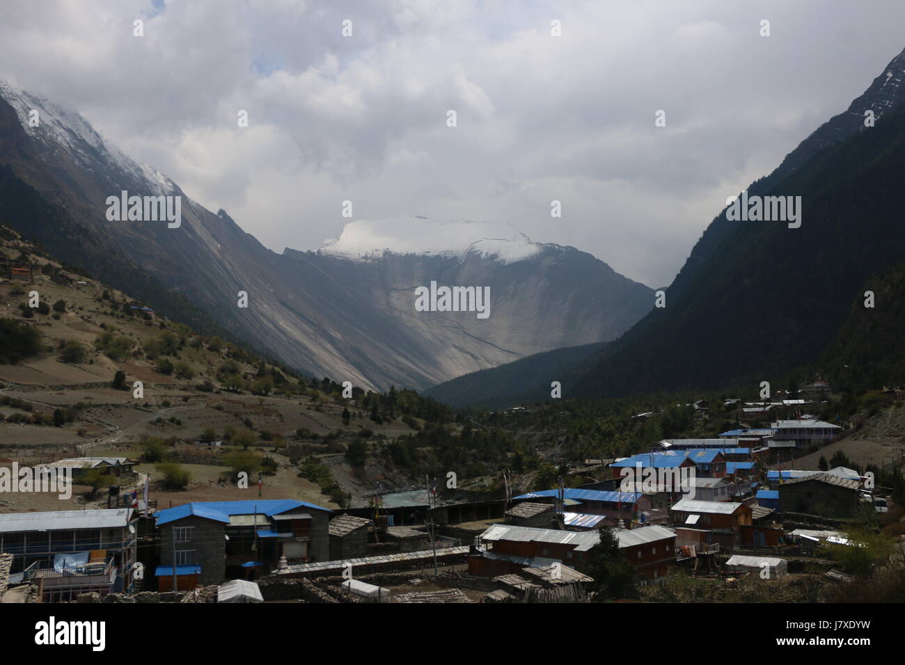 small village under the captivating mountain Manang Nepal Stock Photo ...
