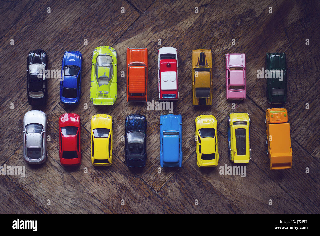 horizontal top view assorted metal colorful toy car collection on brown ...