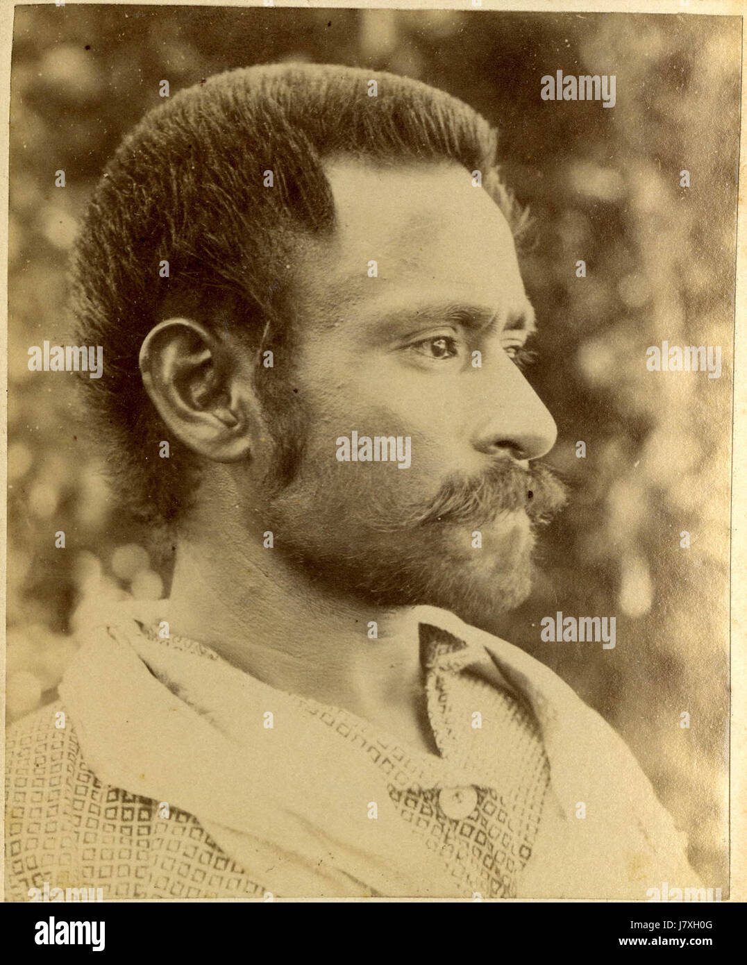 This cabinet card portrait features a man in profile from Polynesia ...