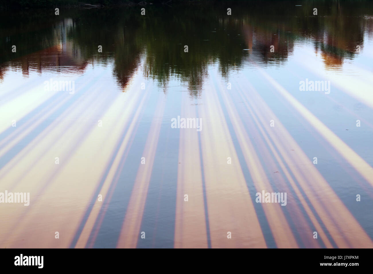 Magic pond. Composition of a pond and rays Stock Photo - Alamy