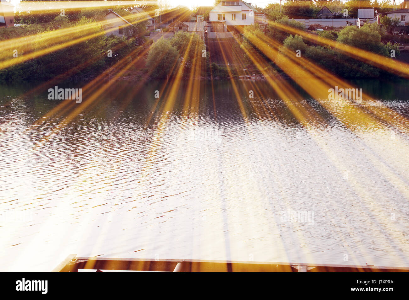 Magic pond. Composition of a pond and rays Stock Photo - Alamy