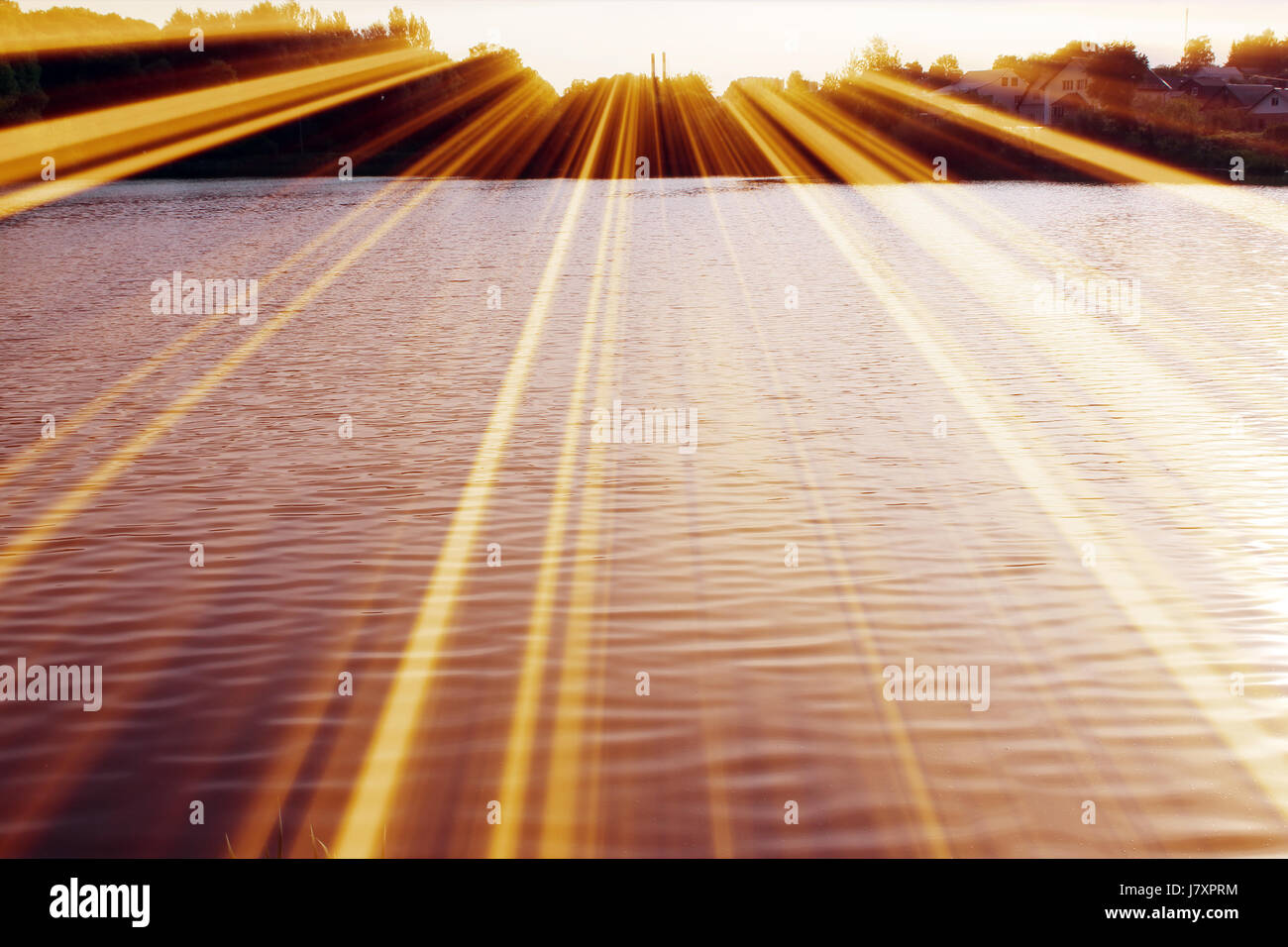Magic pond. Composition of a pond and rays Stock Photo - Alamy