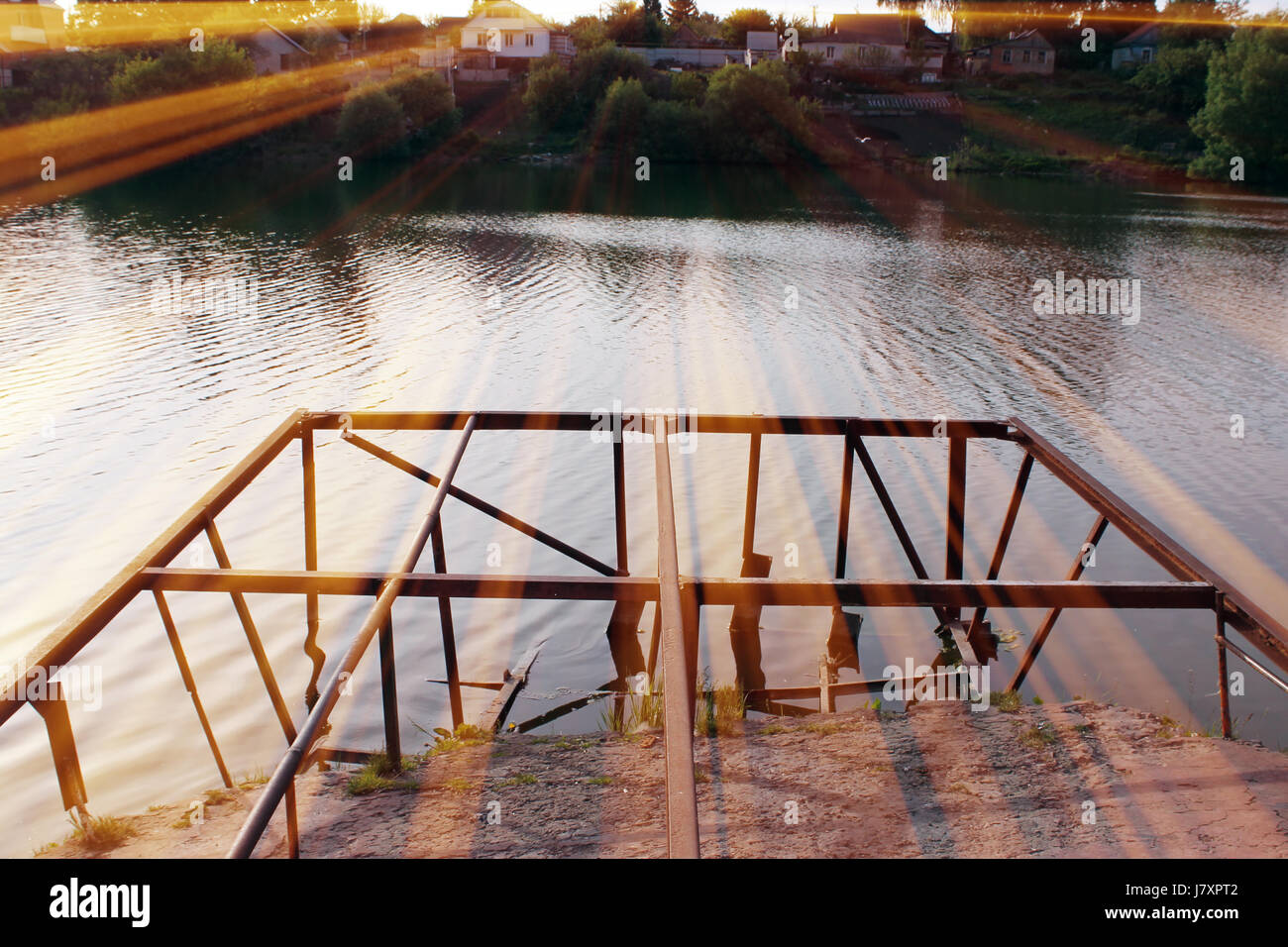 Magic pond. Composition of a pond and rays Stock Photo - Alamy