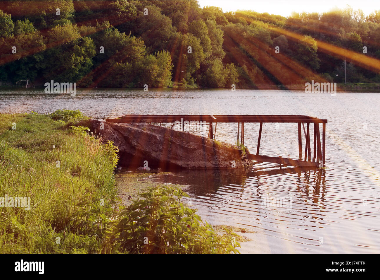 Magic pond. Composition of a pond and rays Stock Photo - Alamy
