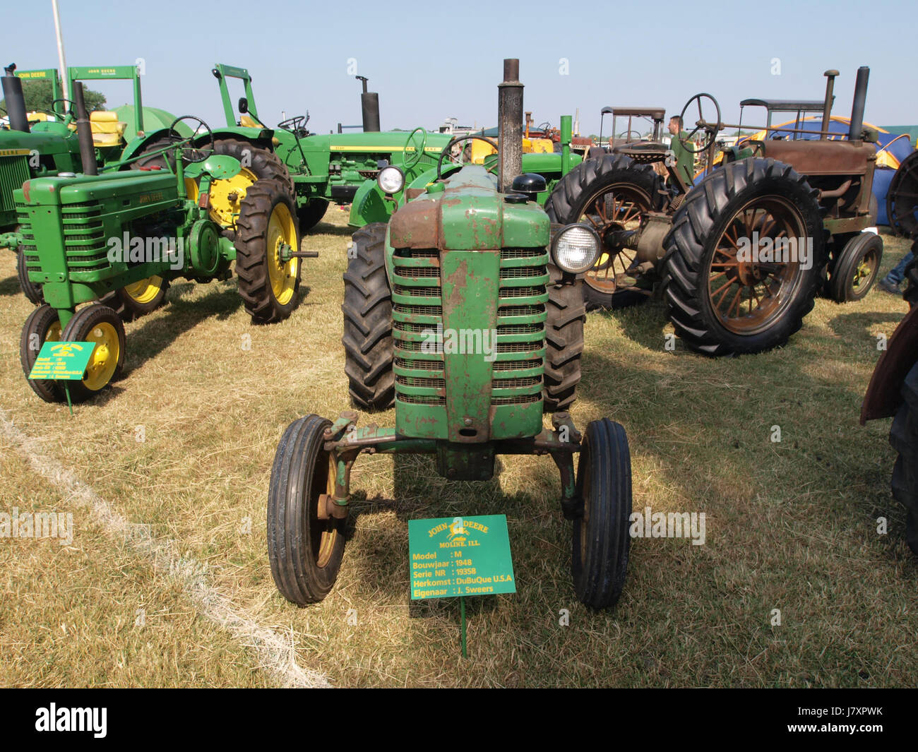 This image showcases a 1948 John Deere Model M tractor, a well-known ...